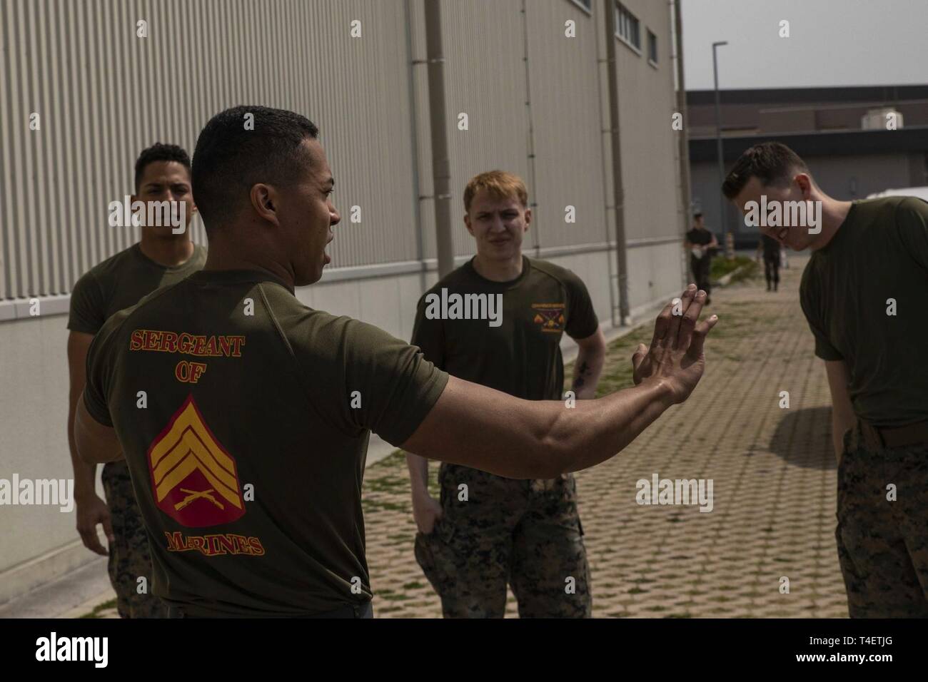 U.S. Marines with Marine Aircraft Group 12 conduct warm-ups before an ...