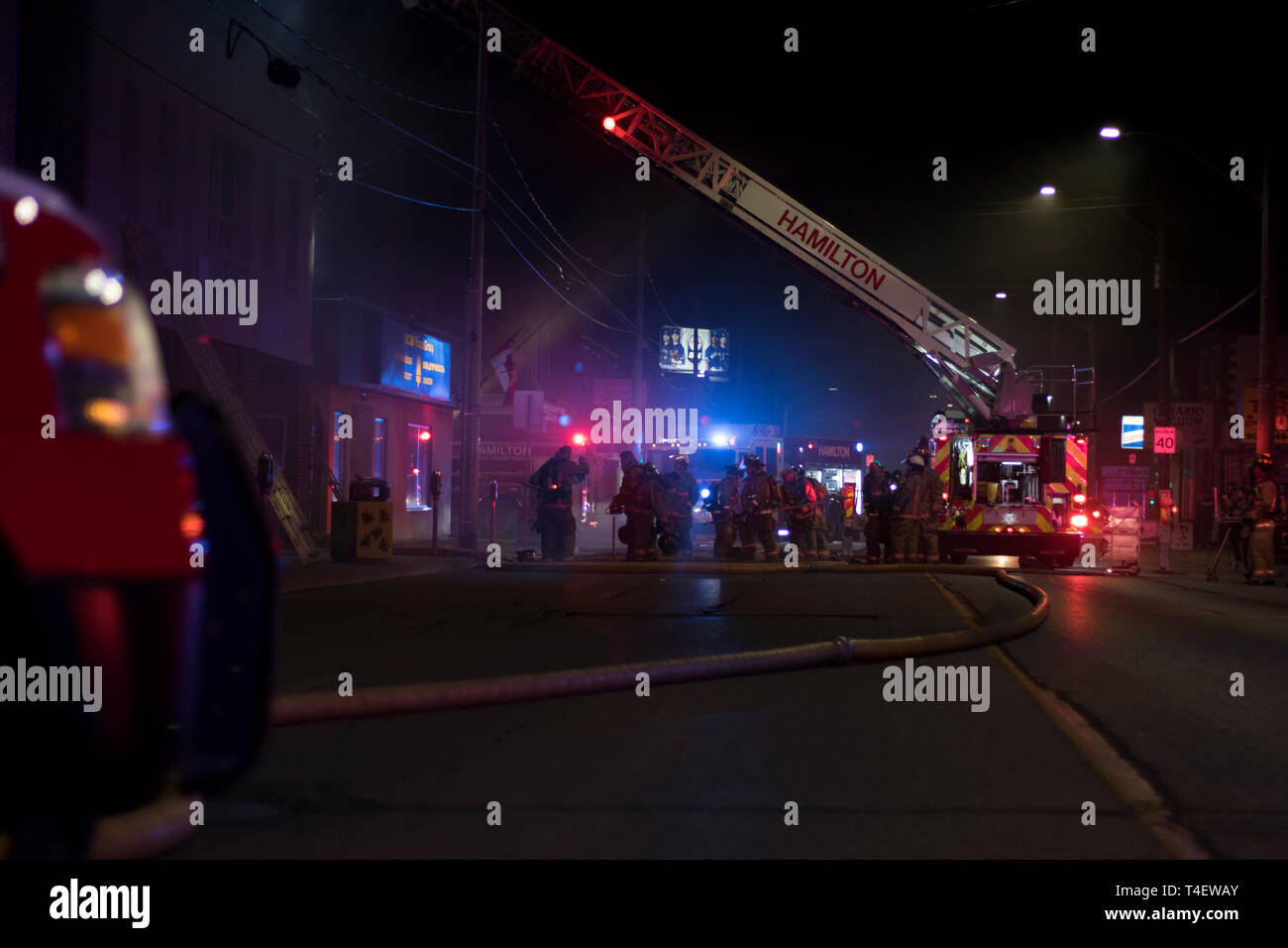 Ontario Canada April 13 2019: Building fire at night with multiple fire ...