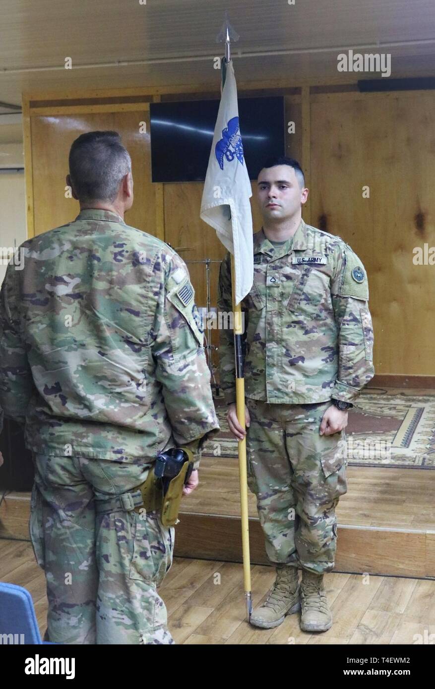 Pfc. Urdanetaparra, 574th Quartermaster Company guidon bearer, faces Lt ...