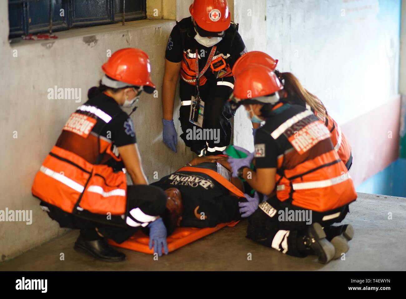 Rescue workers from the Batasan Hills Barangay package an earthquake ...