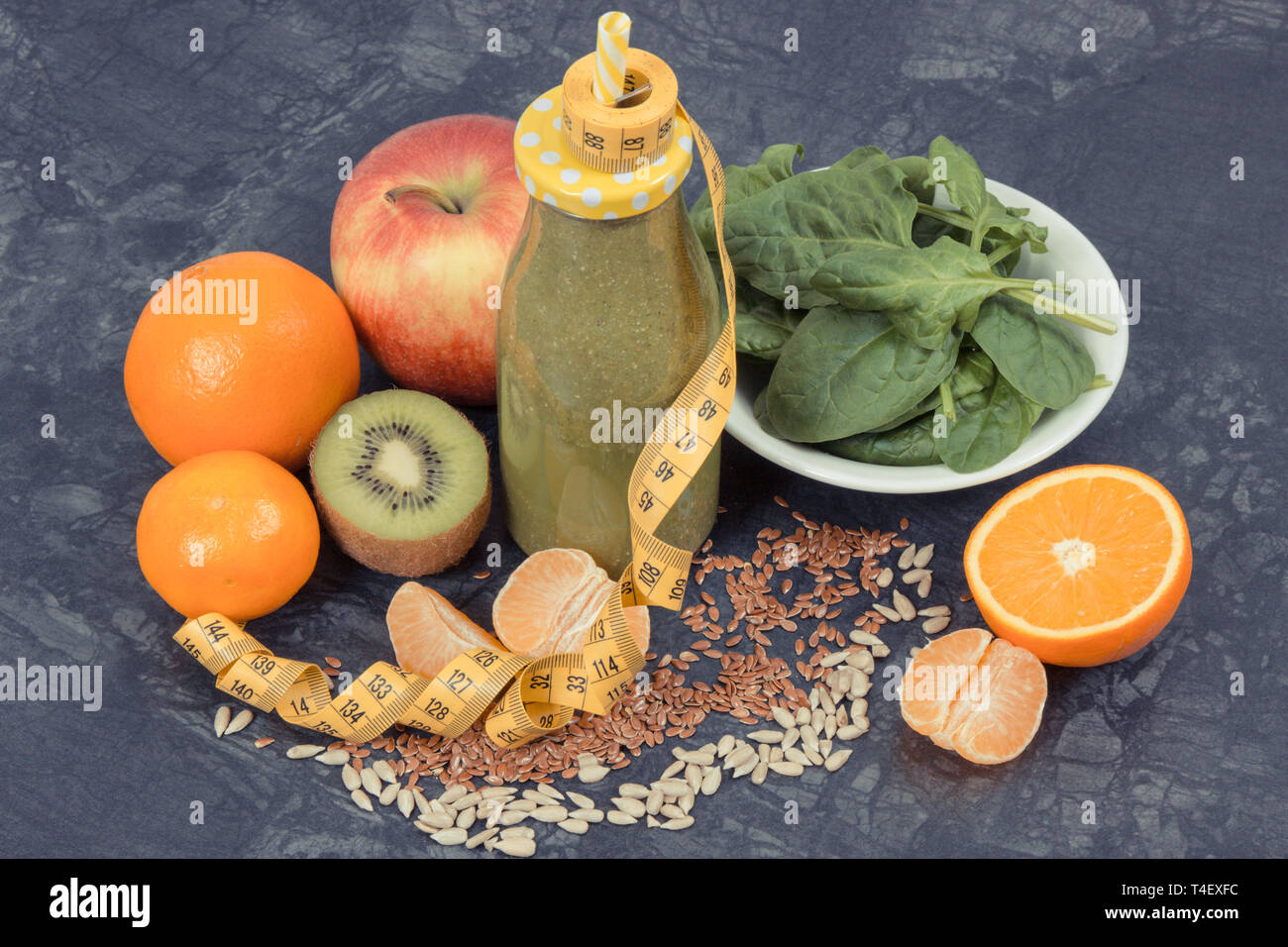 Freshly blended coctail from natural fruits and vegetables and tape ...