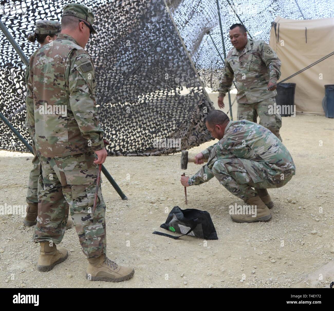 Soldiers from 4th Sustainment Brigade, 4th Infantry Division place a ...
