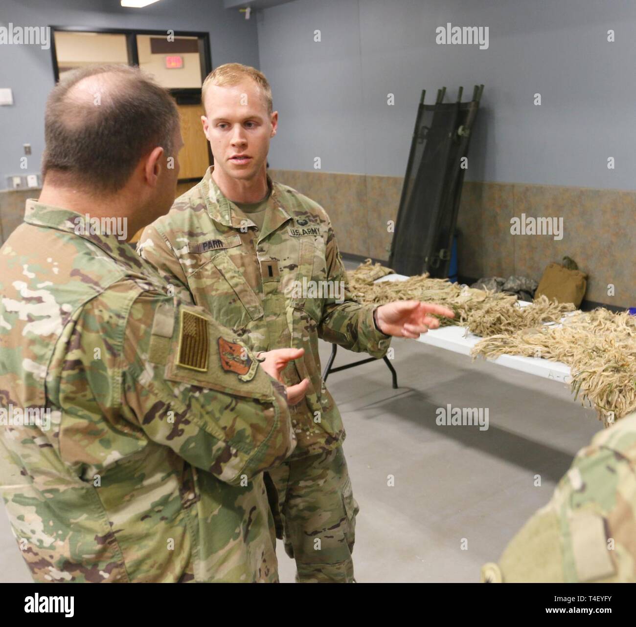 Oregon Army National Guard 1st Lt. Austin Parr (right), with ...