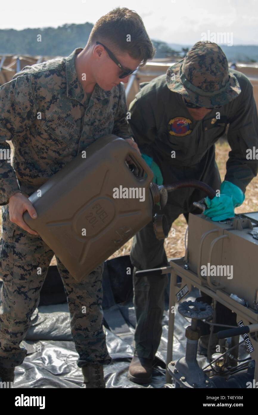 U.S. Marines with Marine Wing Support Squadron 172, add fuel into an ...