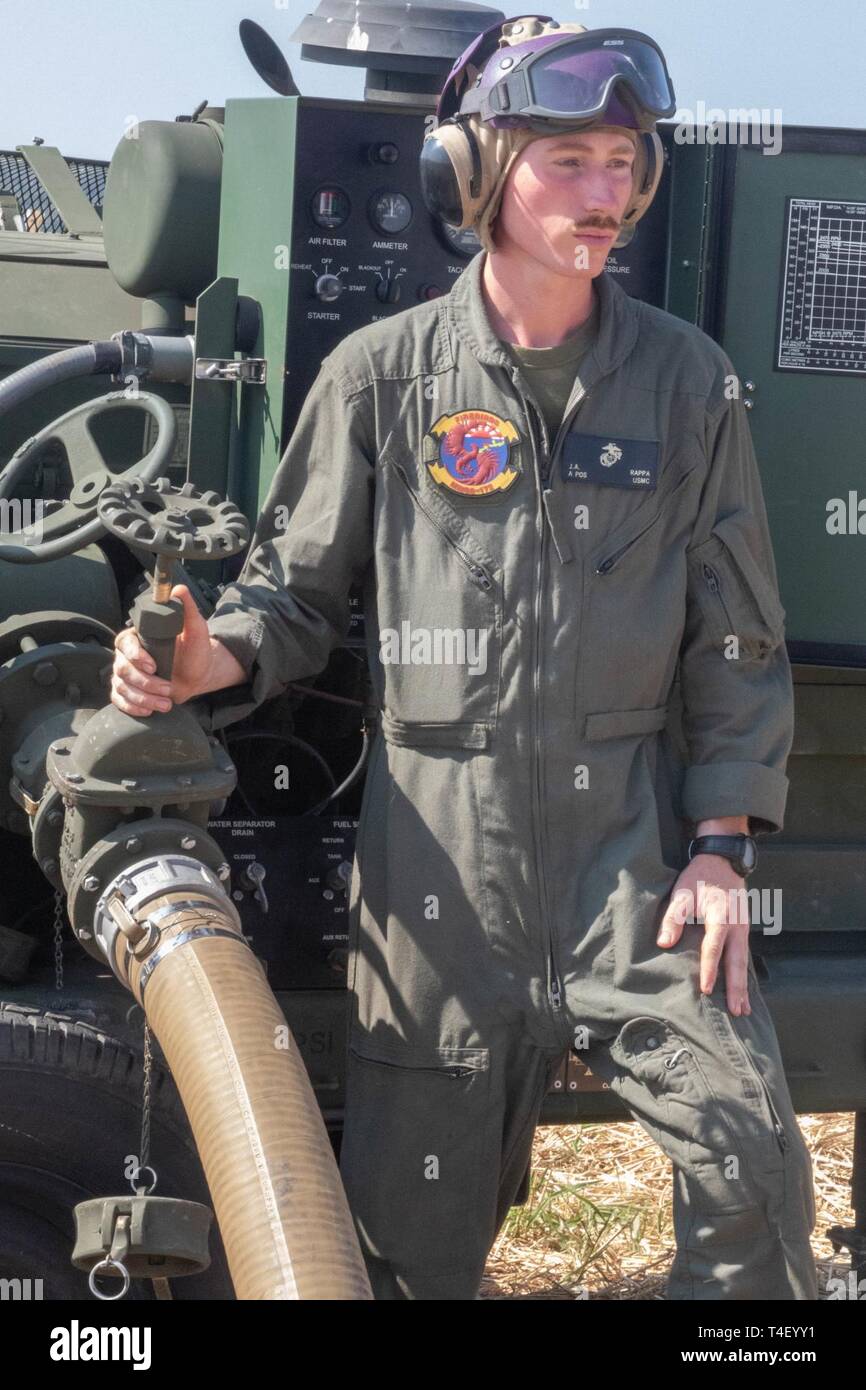 A U.S. Marine with Marine Wing Support Squadron 172, controls the flow ...