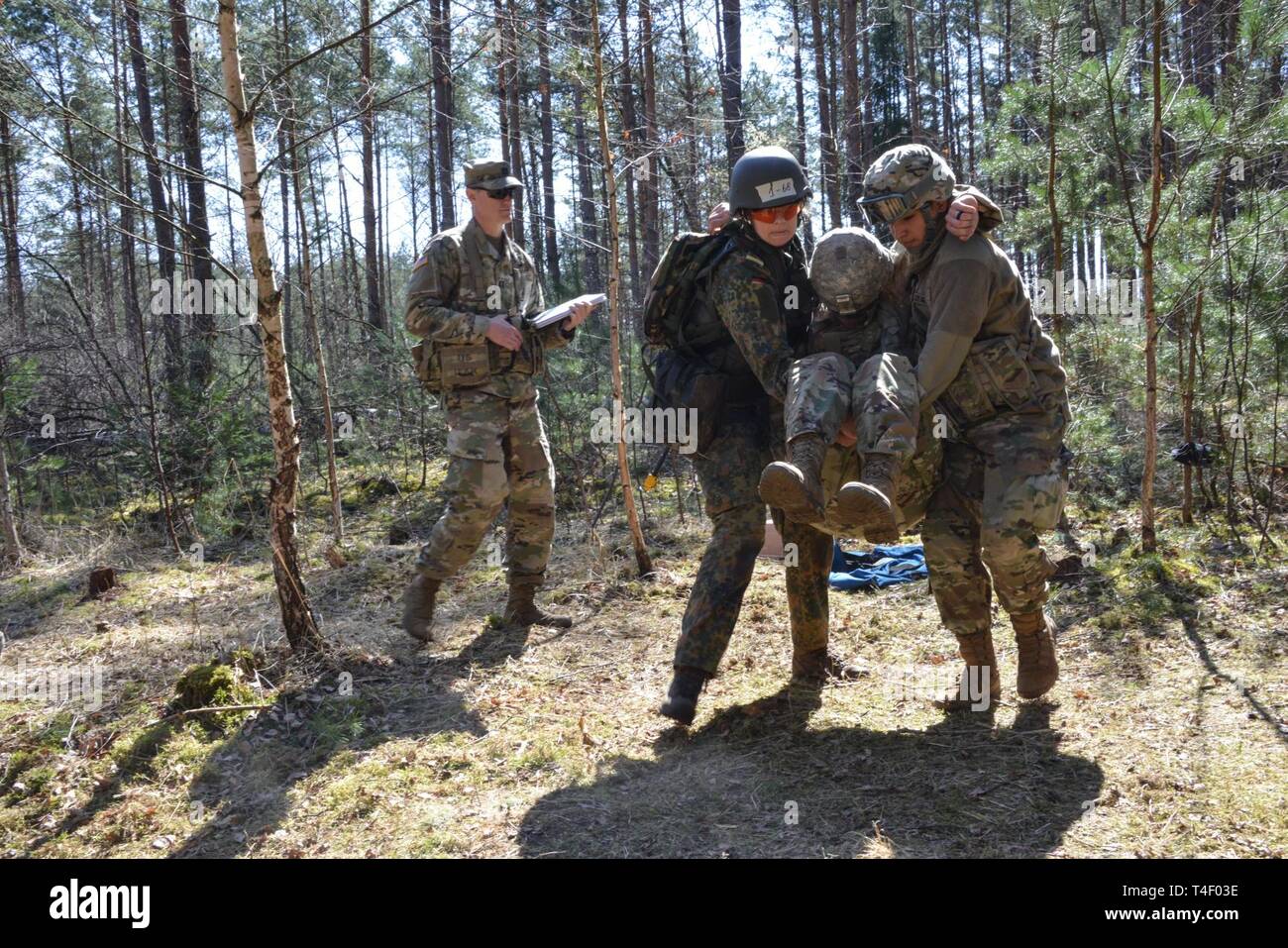 German army Lieutenant Mairin Siegerist, center, carries a simulated ...