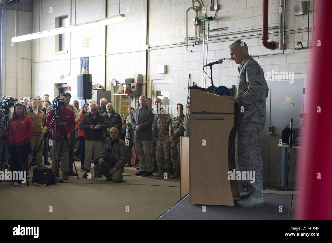 Col. David Smith, commander of the 158th Fighter Wing, speaks to a ...