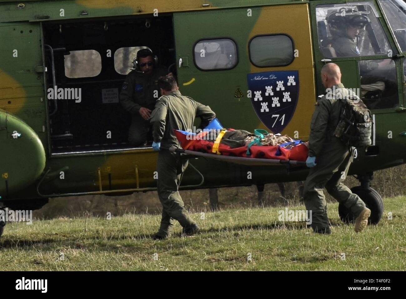 A Romanian aircrew performs a medical evacuation drill at the Role 2 ...