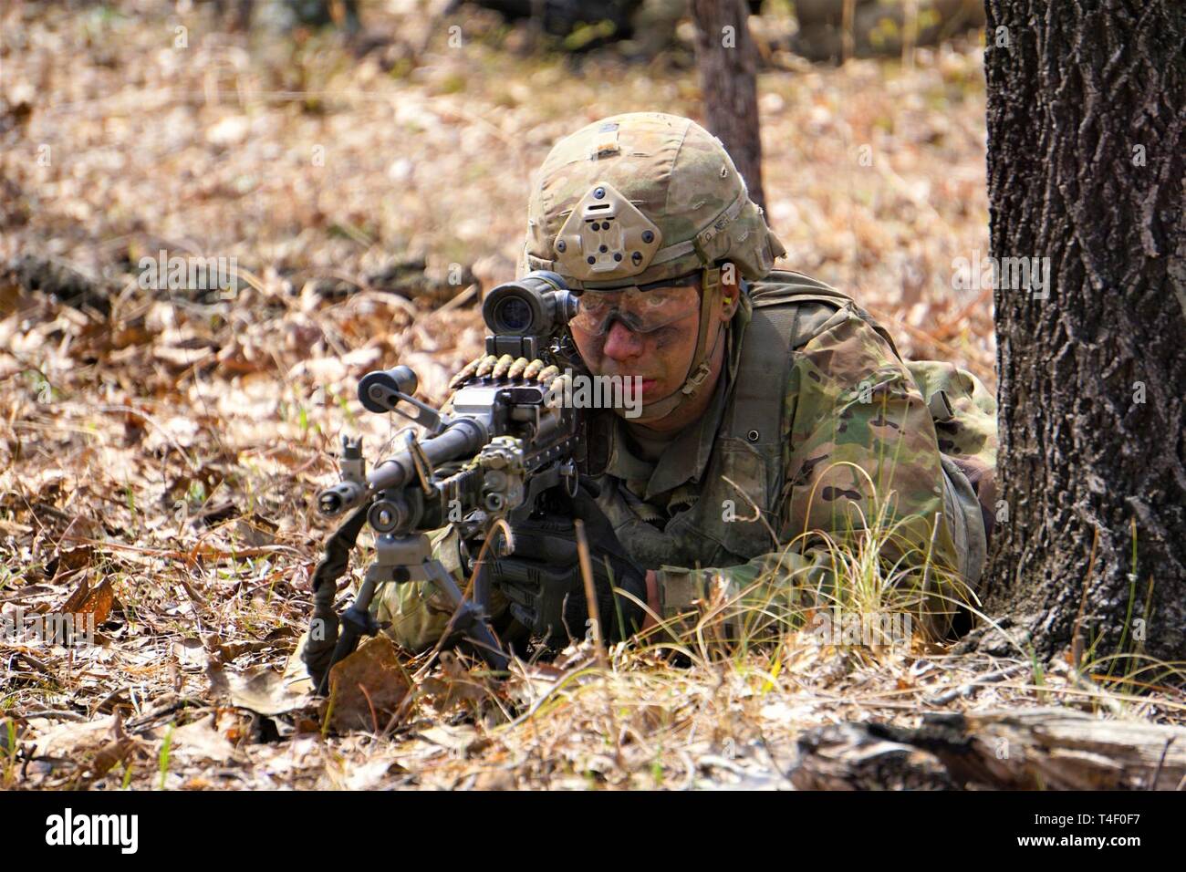 An M240B machine gunner keeps watch from a security position as part of ...