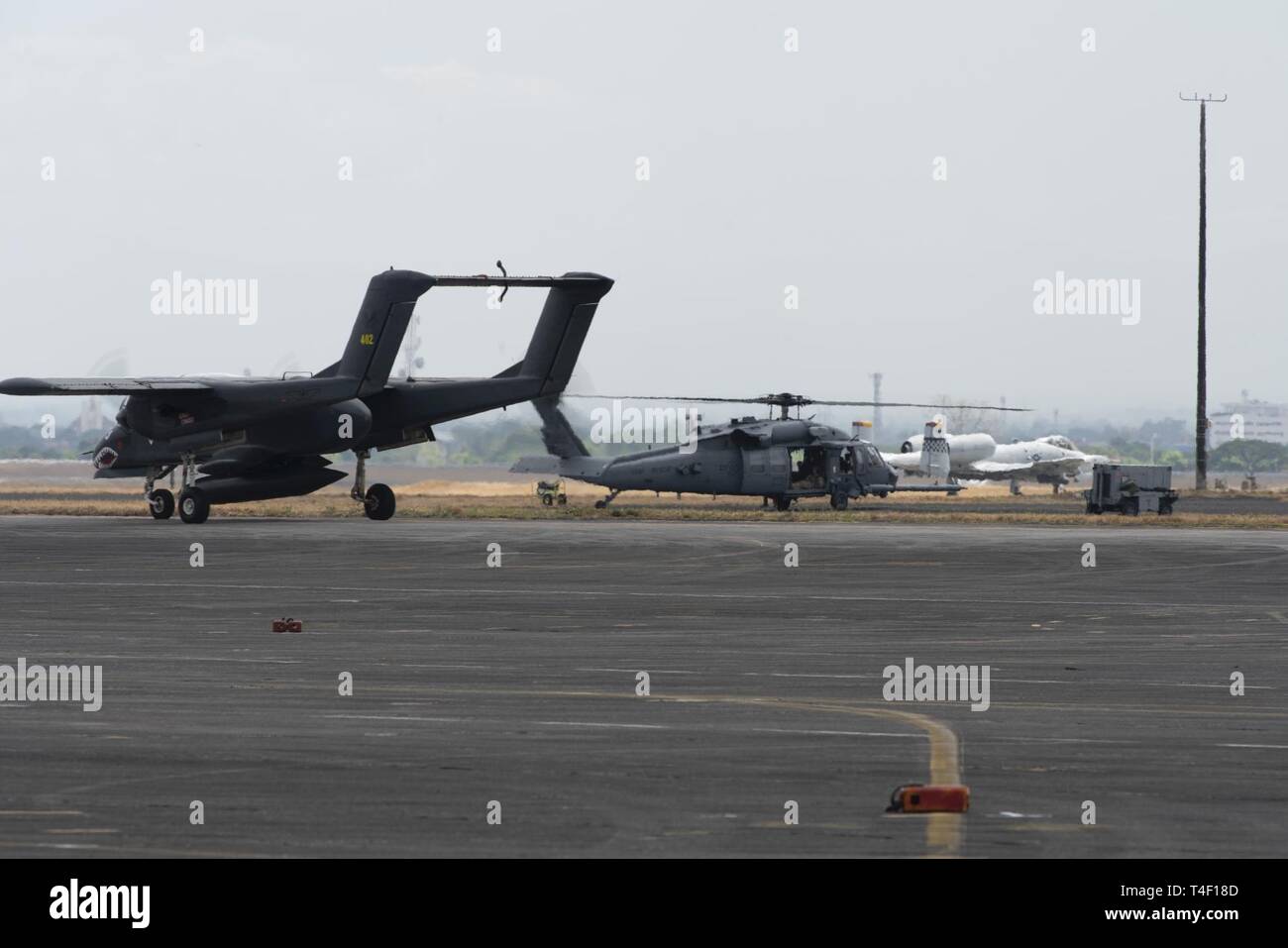 A Philippine Air Force OV-10 Bronco, left, a U.S. Air Force HH-60 Pave ...