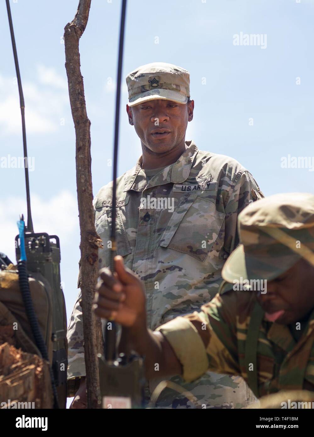A Zambian soldier talks through troop positioning and communication ...