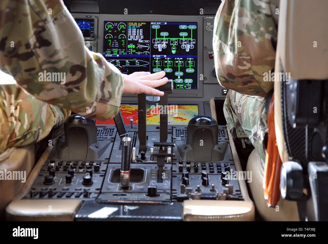 A pilot performs a pre-flight inspection on an E-11A aircraft outfitted ...