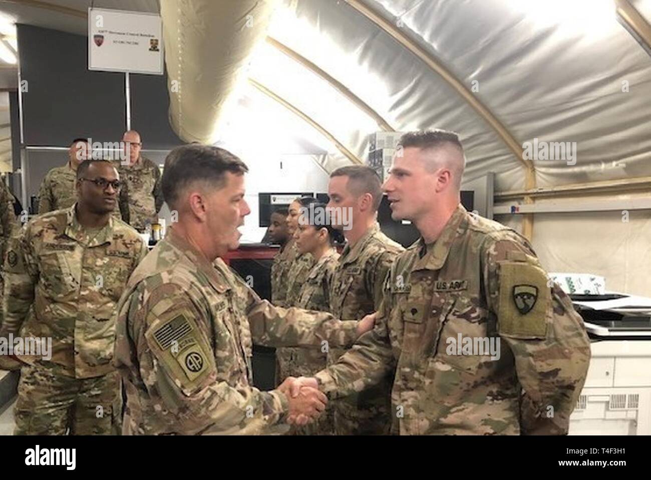 Spc. Corbin Harrison, 420th Transportation Battalion, receives a ...