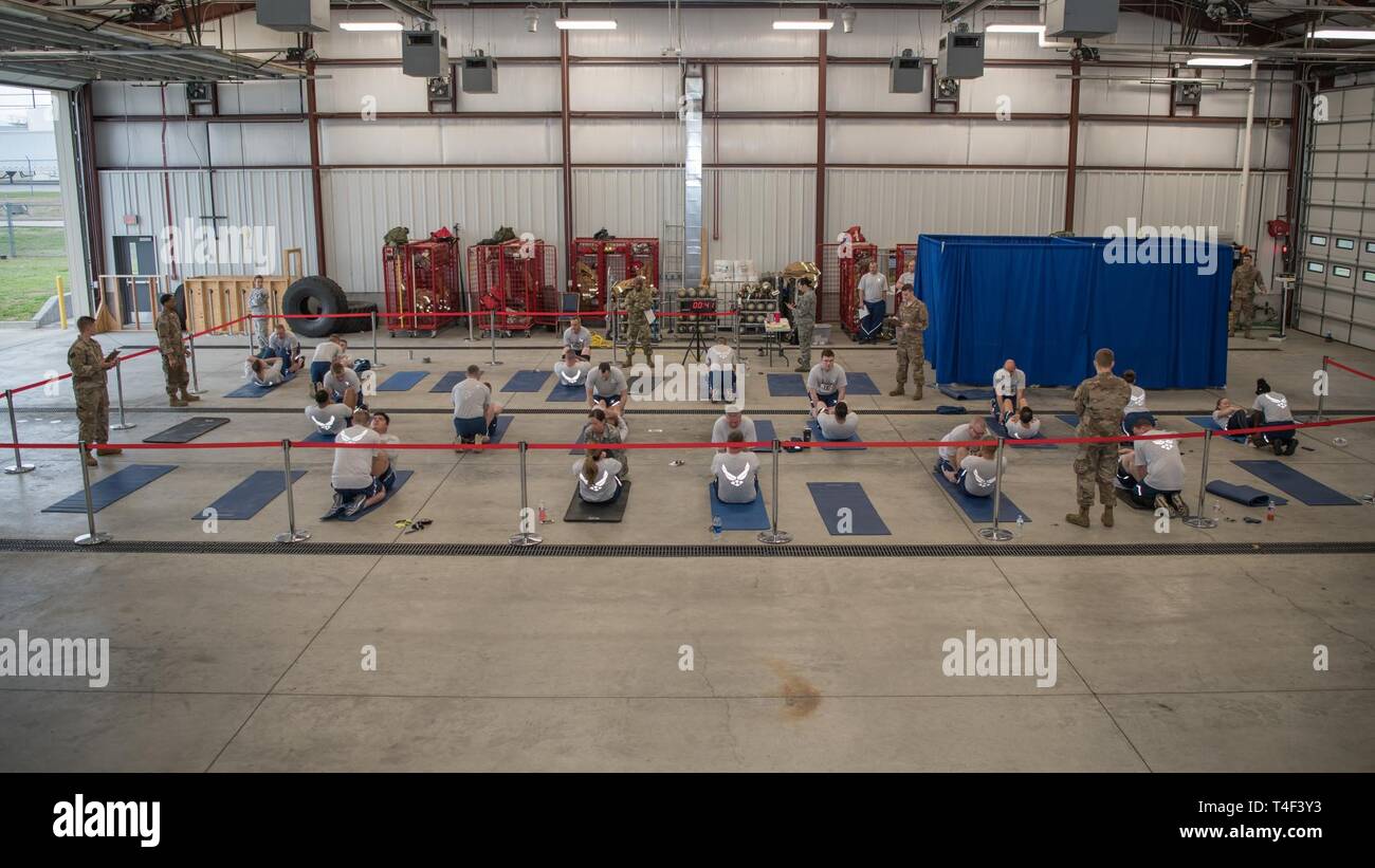 138th Fighter Wing Airmen perform sit-ups during an annual physical ...