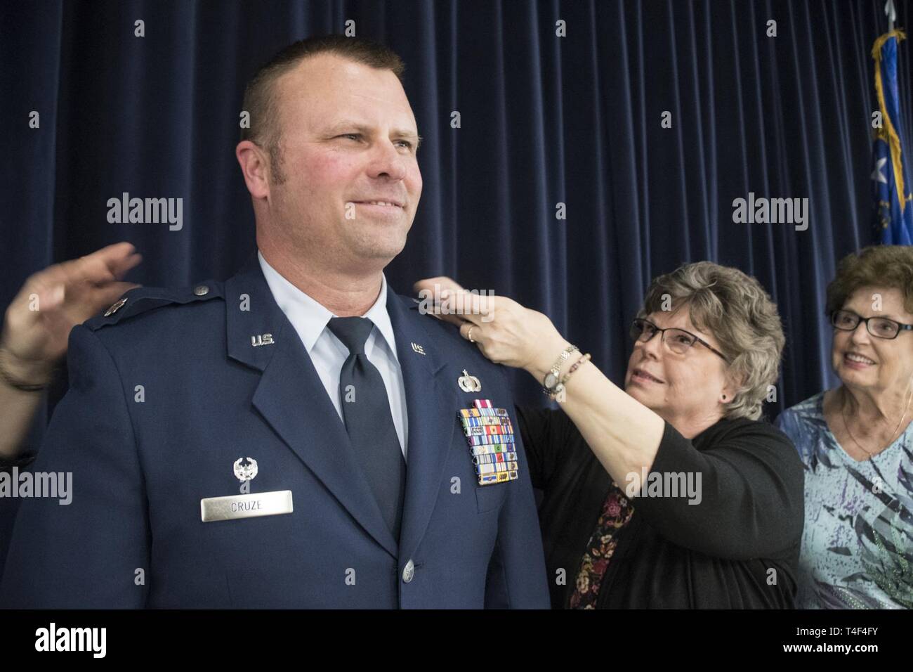 The 152nd Comptroller Flight commander, Maj. Shaun Cruze is promoted to ...