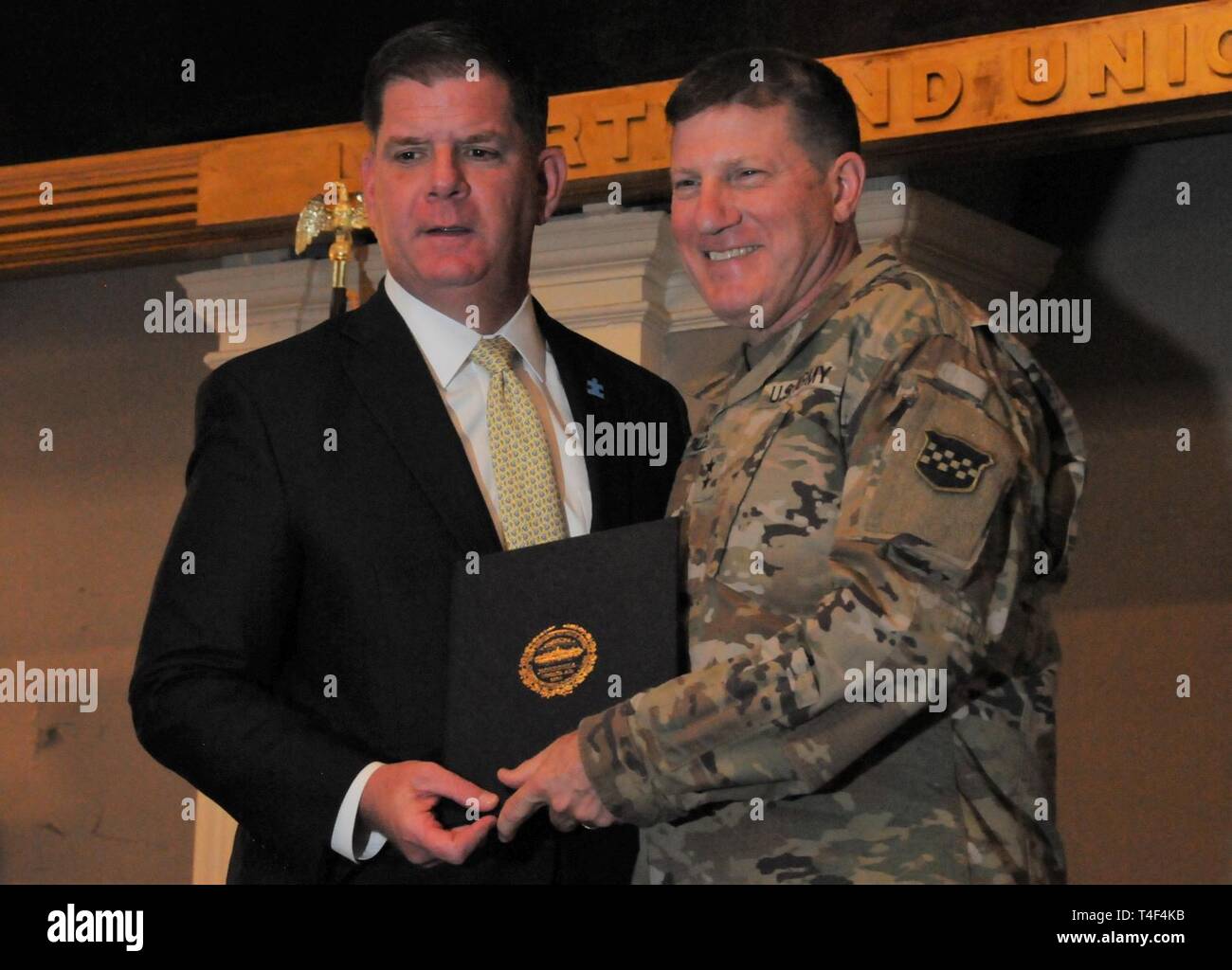 Boston Mayor Martin J. Walsh, left, presents a proclamation declaring ...