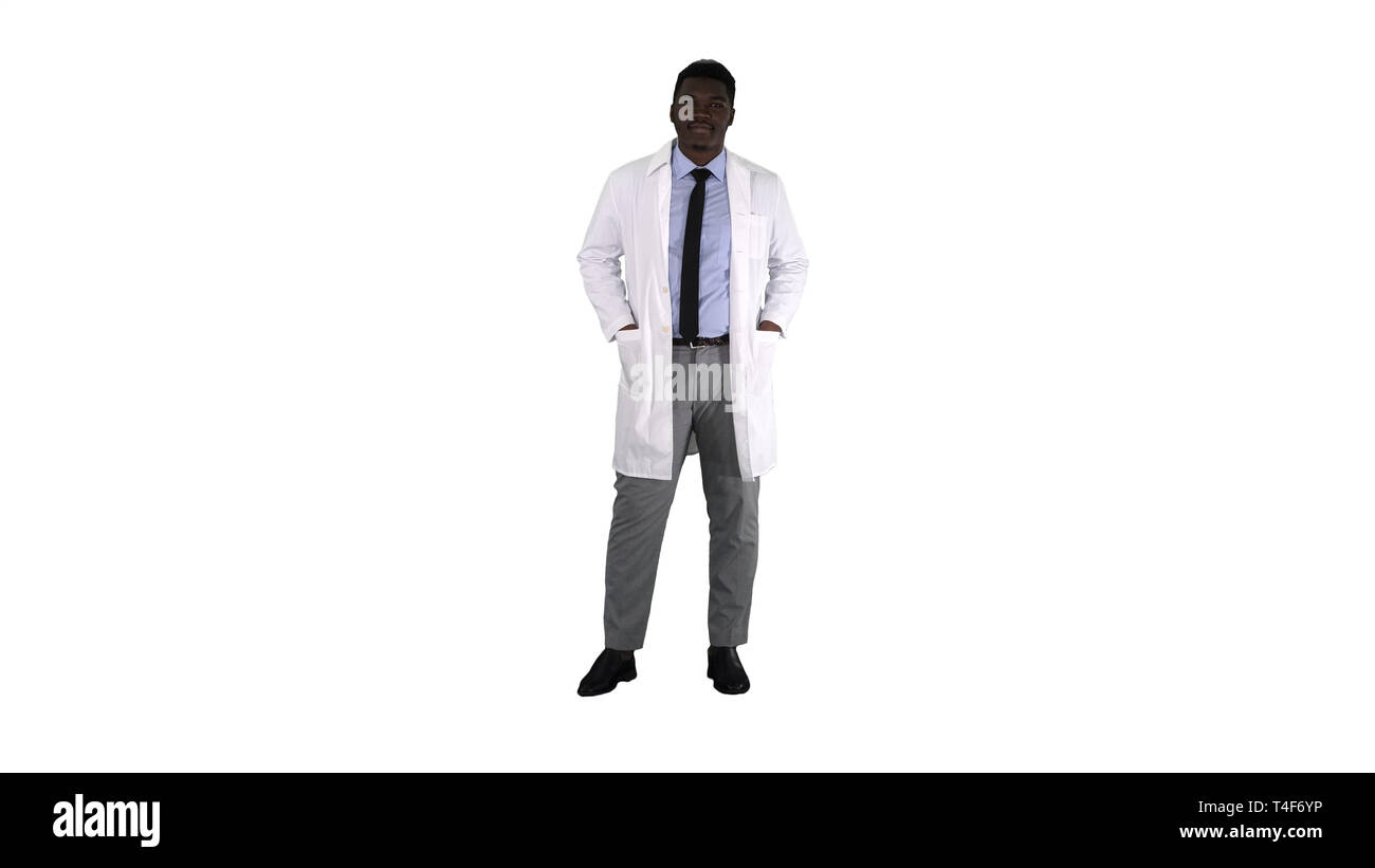 Male African Doctor Standing With Hands In His Pockets on white ...