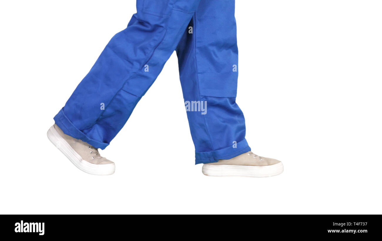 Legs of woman construction worker walking on white background Stock ...