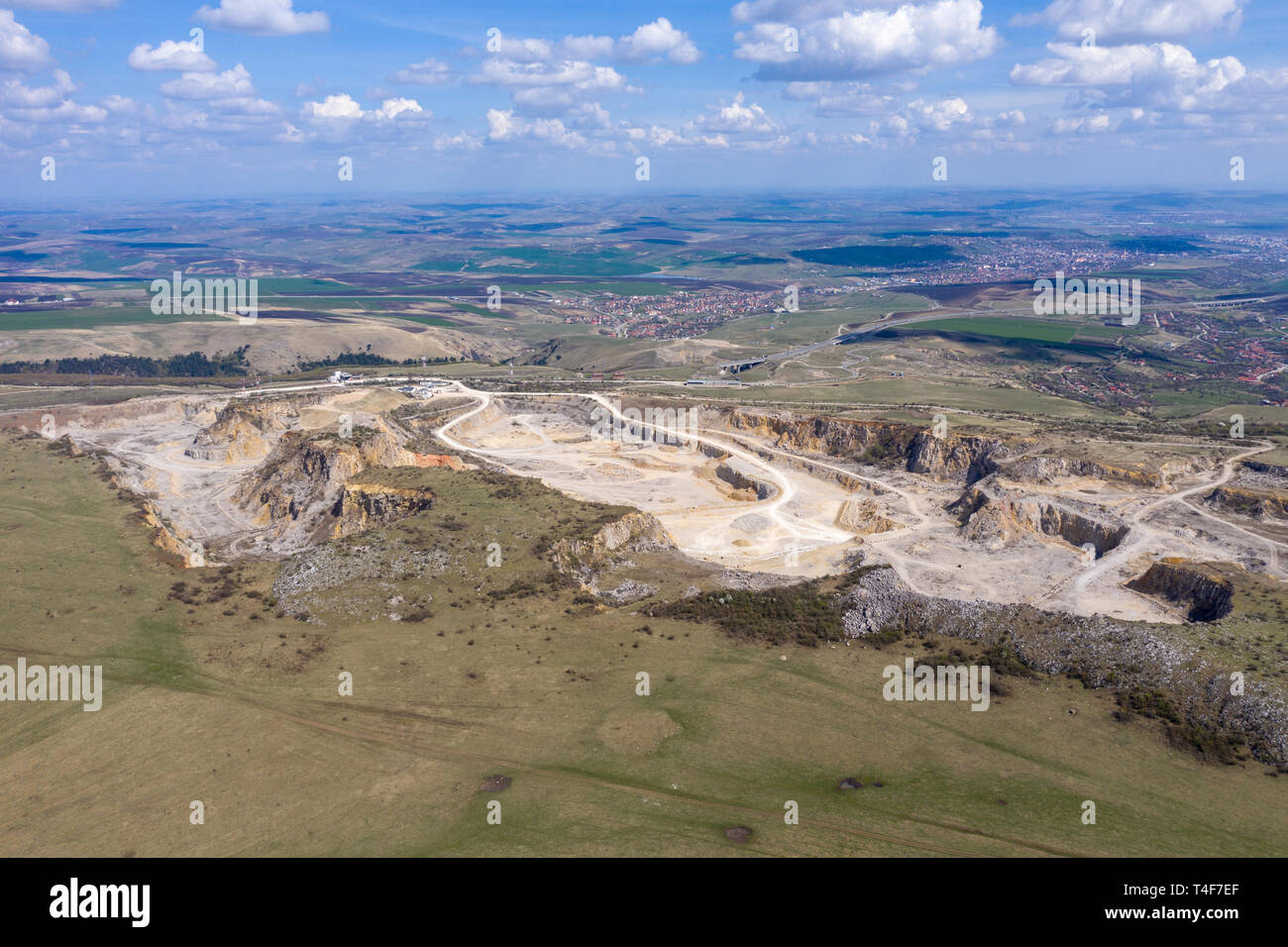 Aerial drone view of a limestone quarry, open pit mine, mining industry ...