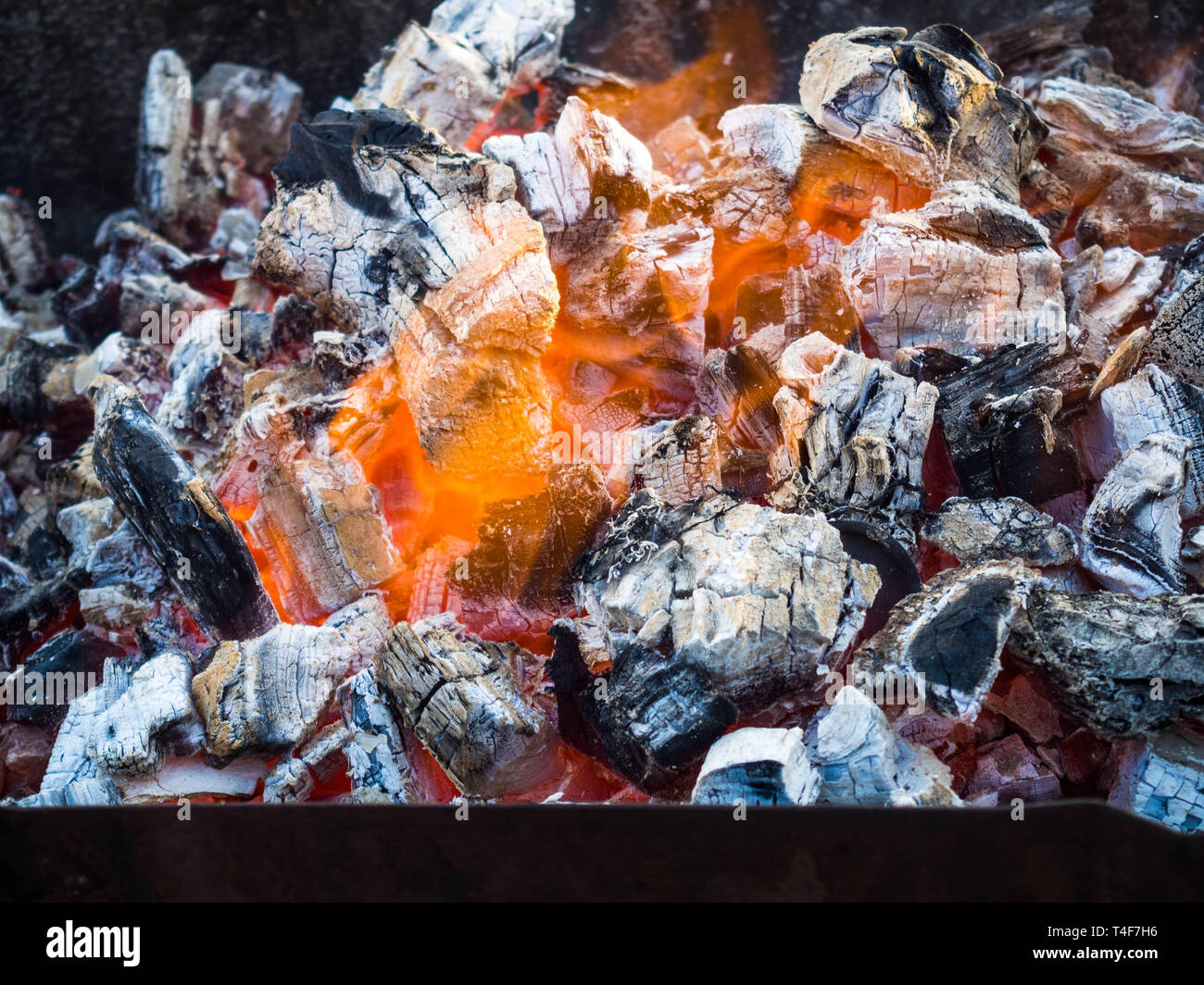 Photo of hot sparking live-coals burning in a barbecue Stock Photo - Alamy