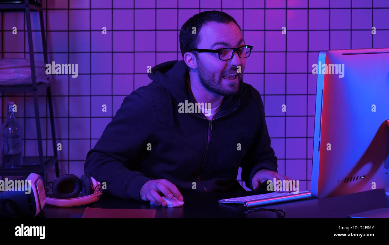 Gamer playing a game very excited and commenting on the game Stock ...