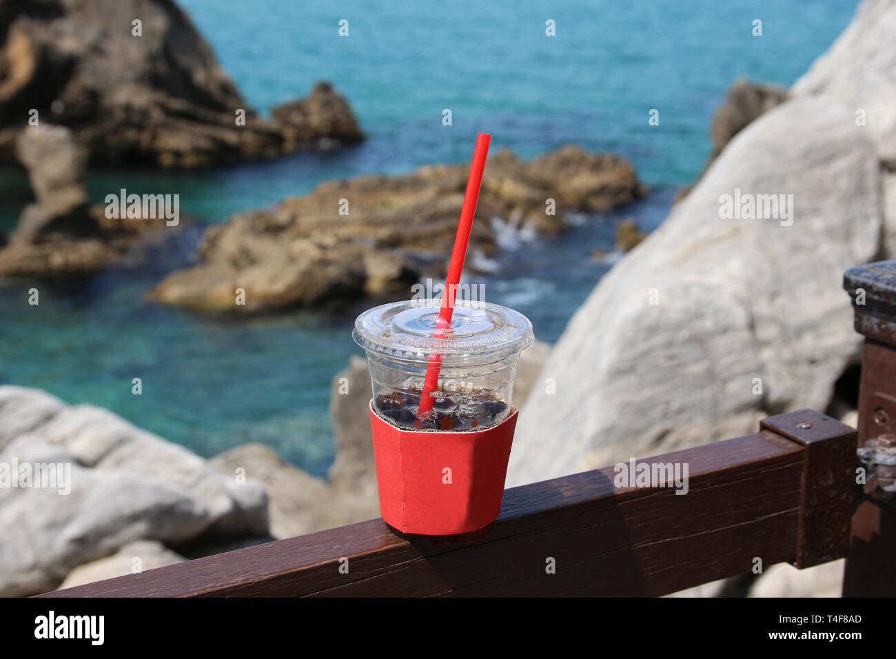 Photo of a coffee while taking a walk Stock Photo - Alamy