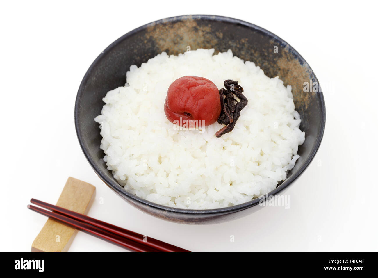 Japanese cooked white rice with salt plum on white background Stock ...