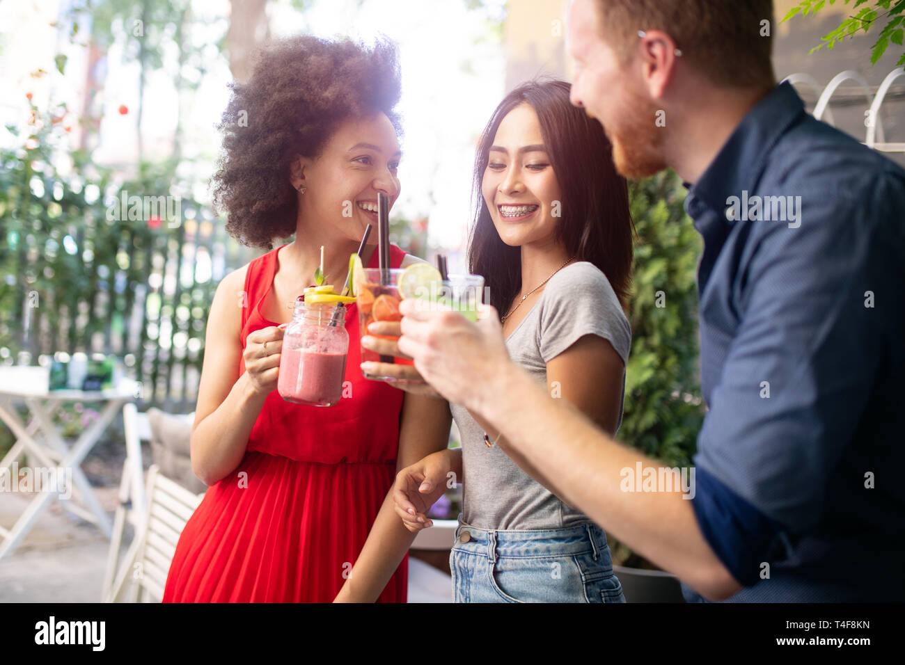 Group of friends having fun together. People talking laughing and ...