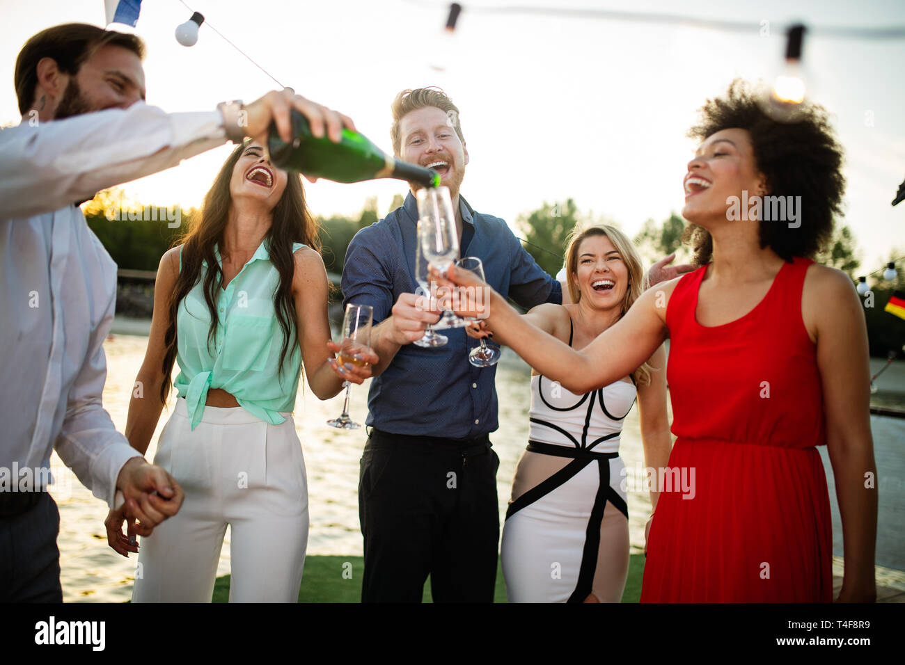 Group of happy people or friends having fun at party Stock Photo - Alamy