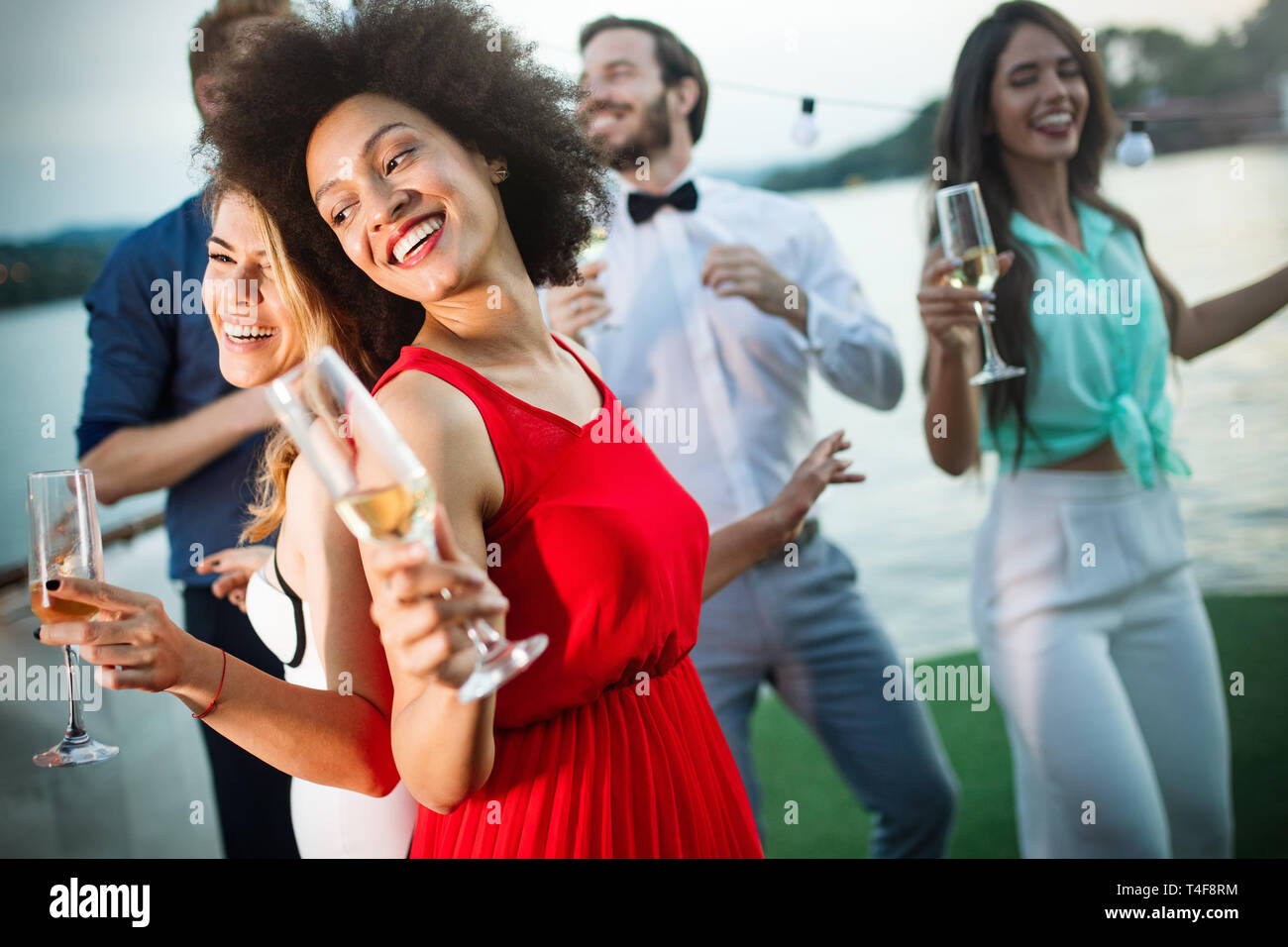 Group of friends having fun and celebrating group gathering Stock Photo ...