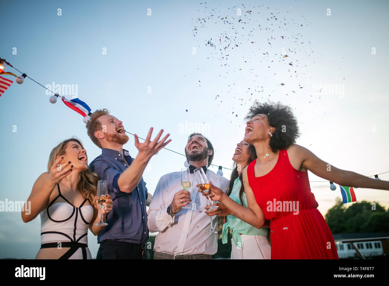 Group of happy people or friends having fun at party Stock Photo - Alamy