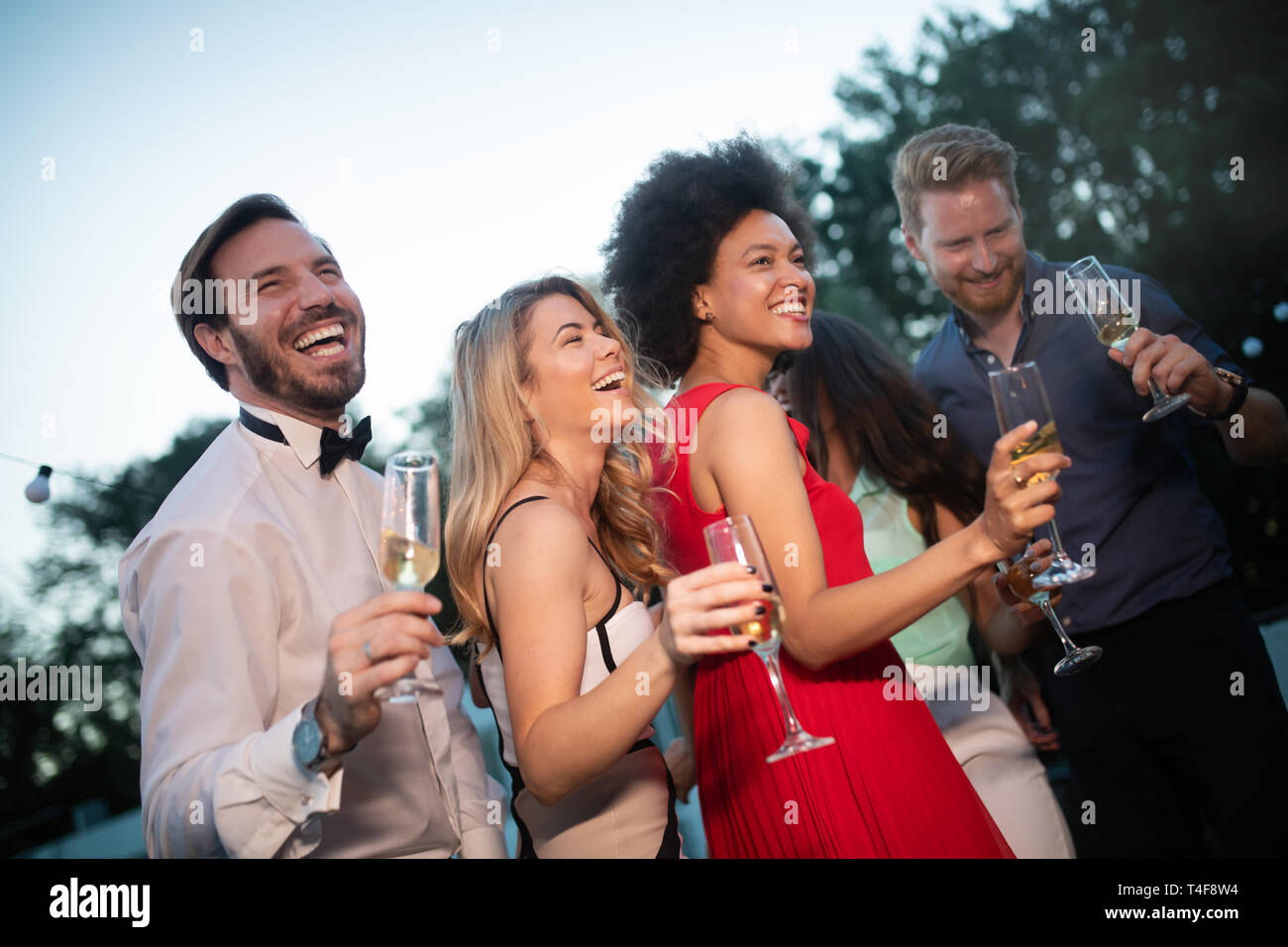 Group of happy people or friends having fun at party Stock Photo - Alamy