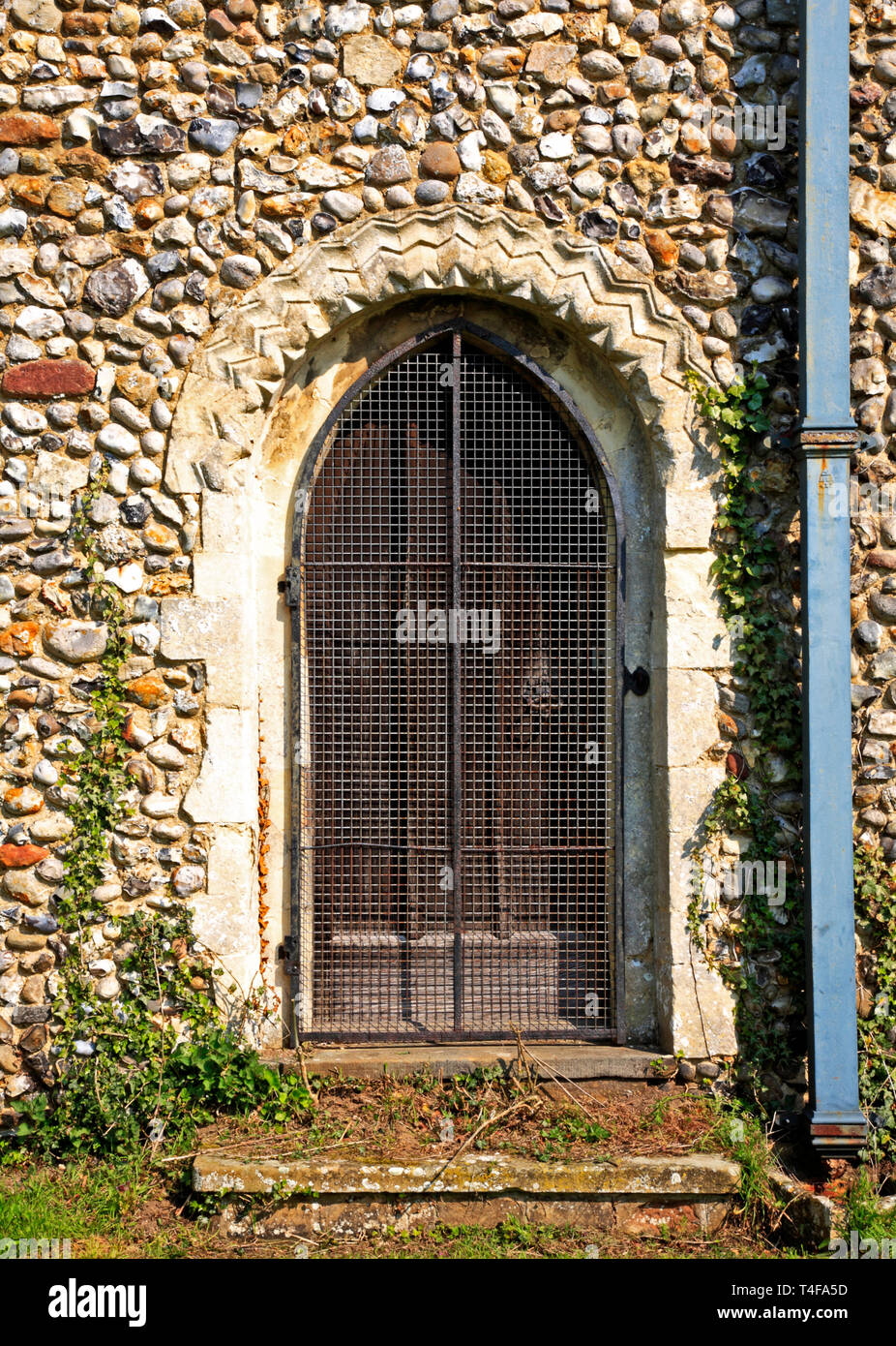A view of a Norman arch in the south wall of the parish Church of St ...
