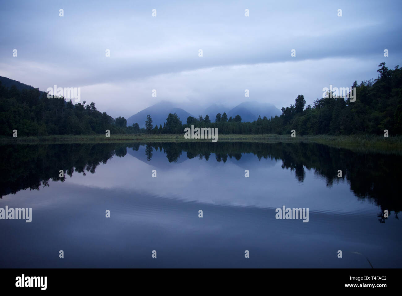 Zealand fiordland lake reflection hi-res stock photography and images ...