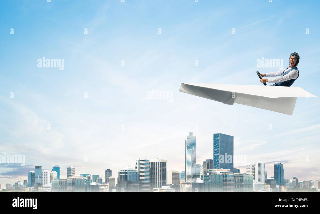 Scared pilot sitting in paper plane Stock Photo - Alamy