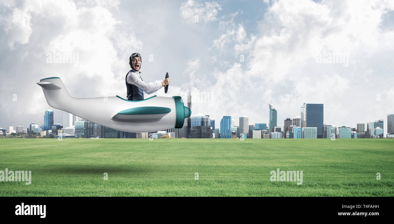 Happy aviator driving small propeller plane Stock Photo - Alamy