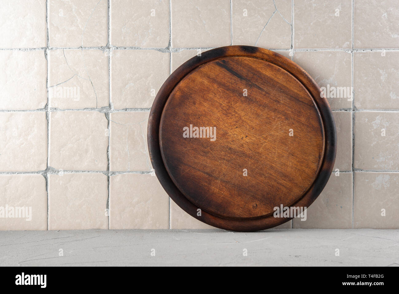 Cutting board on a kitchen background with ceramic tiles Stock Photo ...