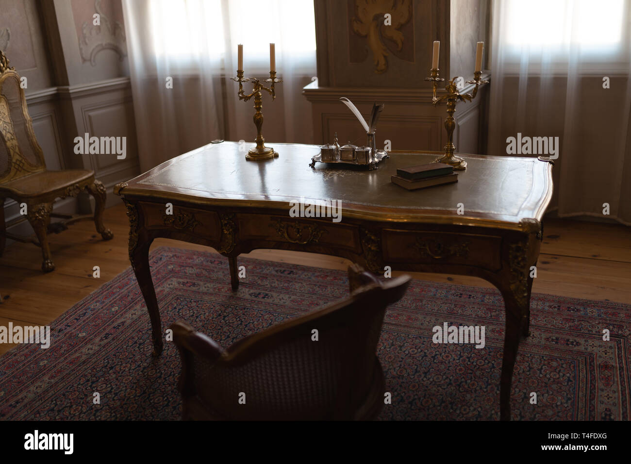 Royal palace table in a cabinet room with chairs and pen and ink Stock ...