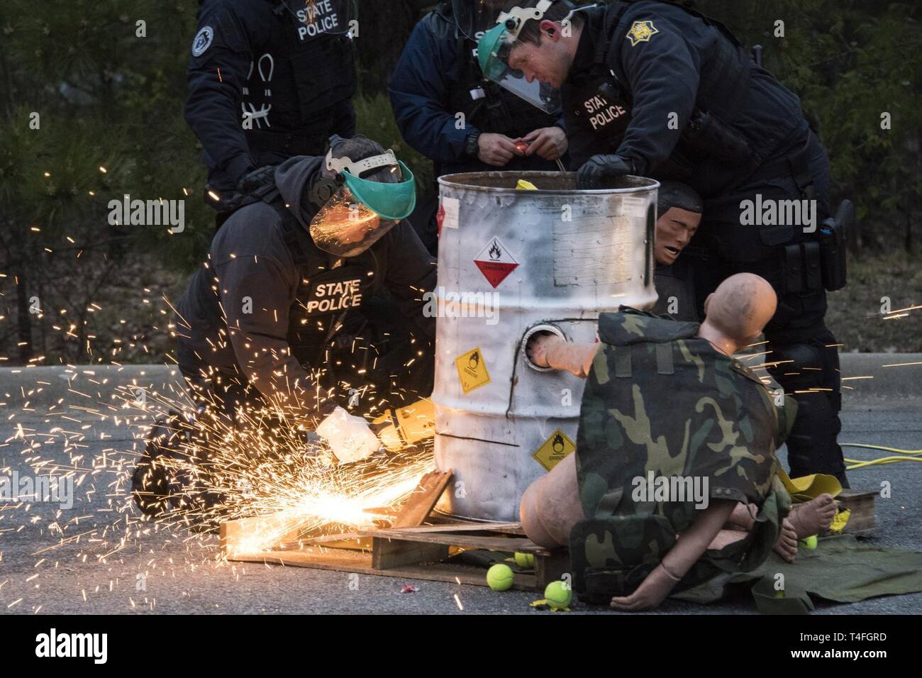 Arkansas State Police officers practice cutting open a “sleeping dragon ...