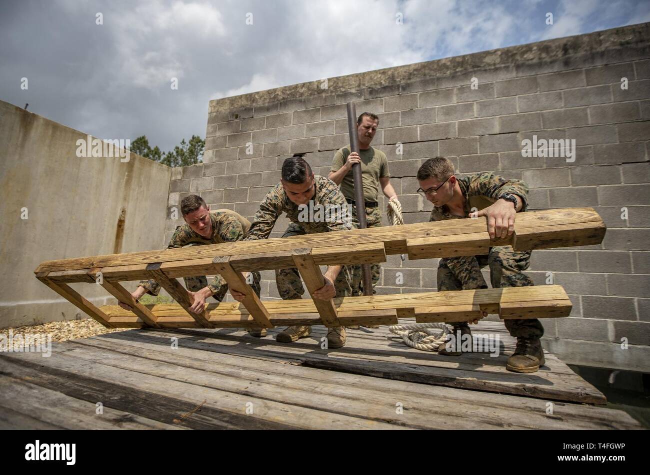 Marines and Sailors with Marine Forces Reserve, work together during a ...