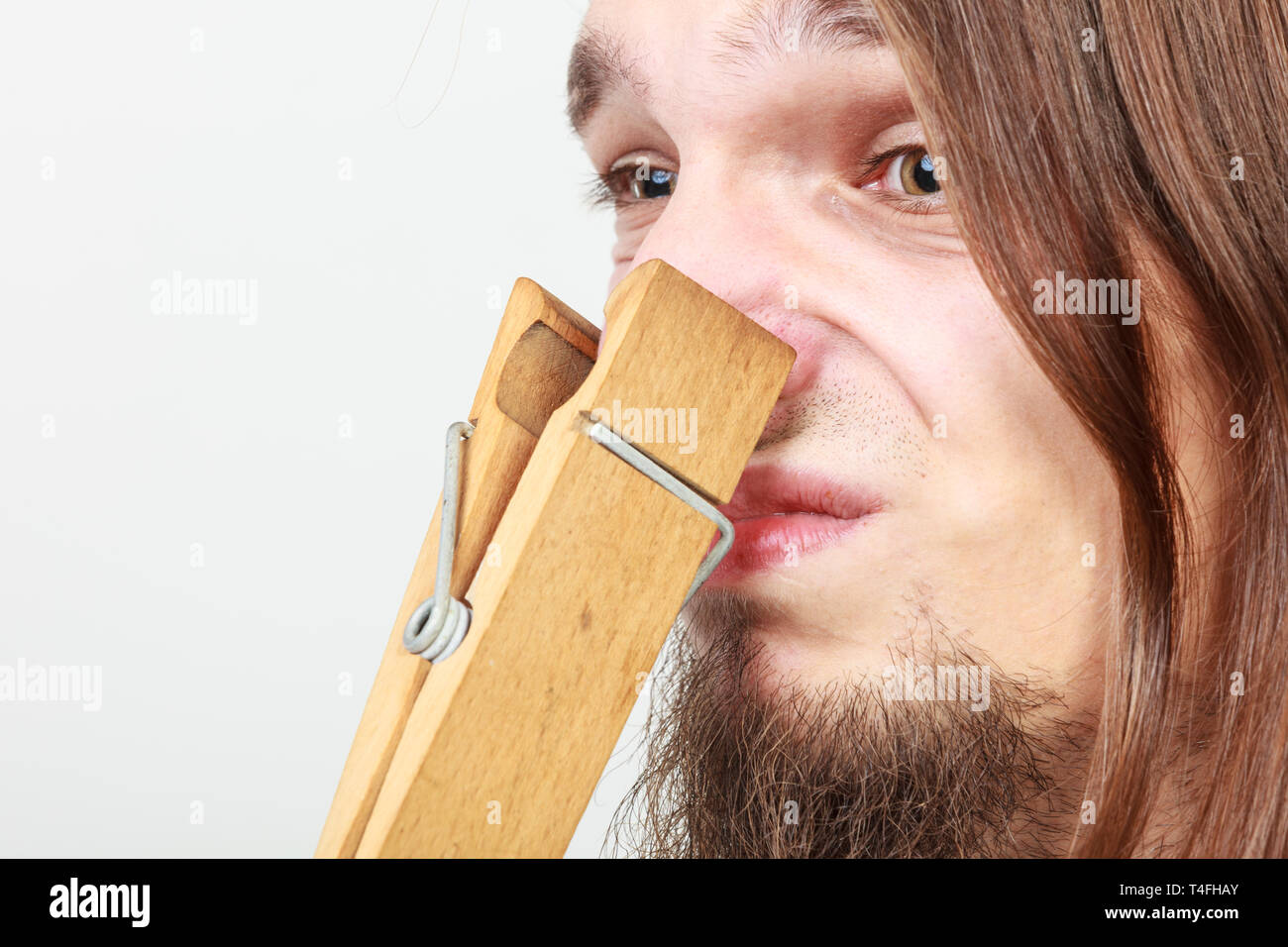 Peg on nose man hi-res stock photography and images - Alamy