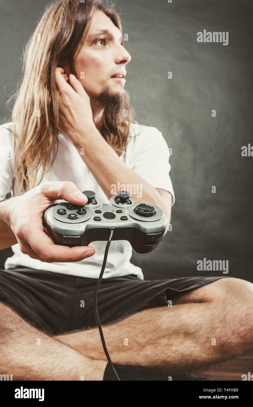 Addiction effects concept. Young unhappy depressed man with pad ...