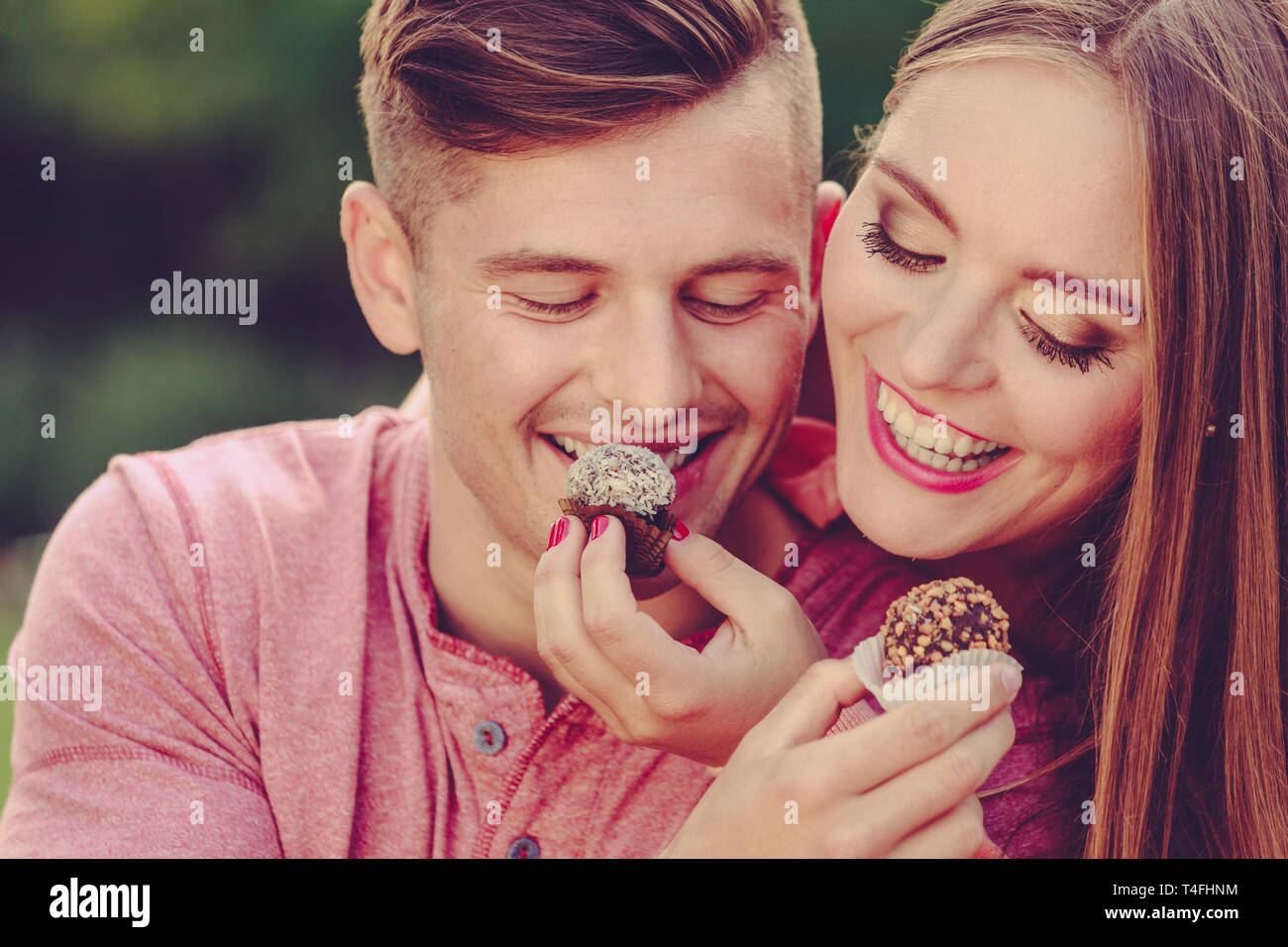 Cute romantic couple feeding other hi-res stock photography and images ...