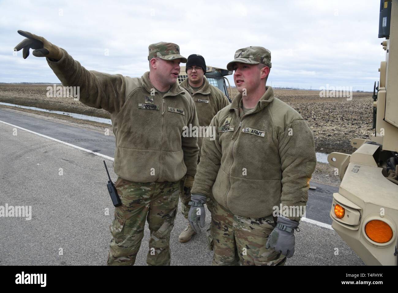 Army Sgt. Jacob Dykema points directions to Sgt. Tyler Schick, both ...