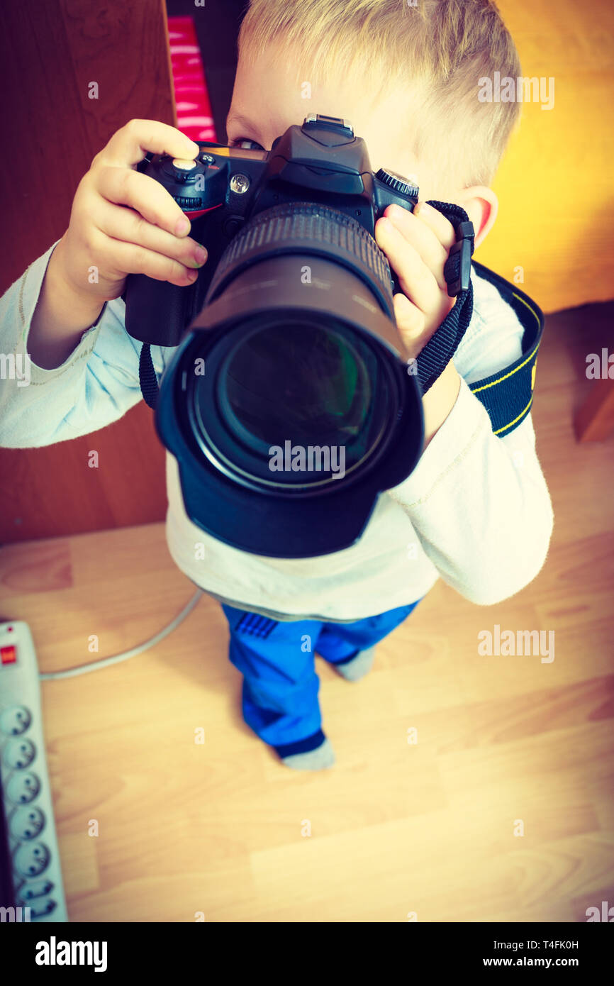 Child passion and hobbies concept. Kid playing with big professional ...