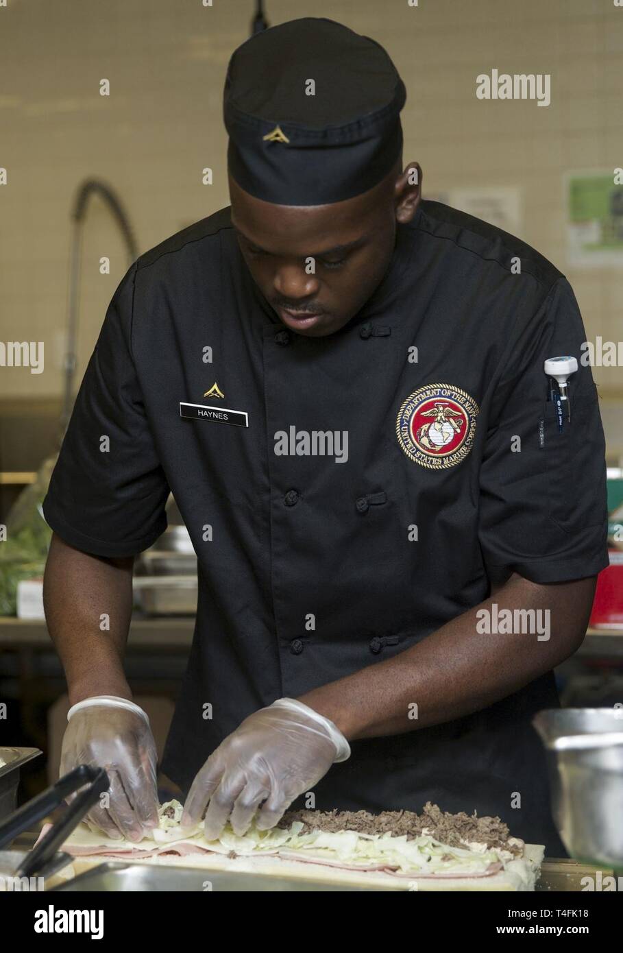 U.S. Marine Corps Lance Cpl. Tquan Haynes, food service specialist, 2nd ...