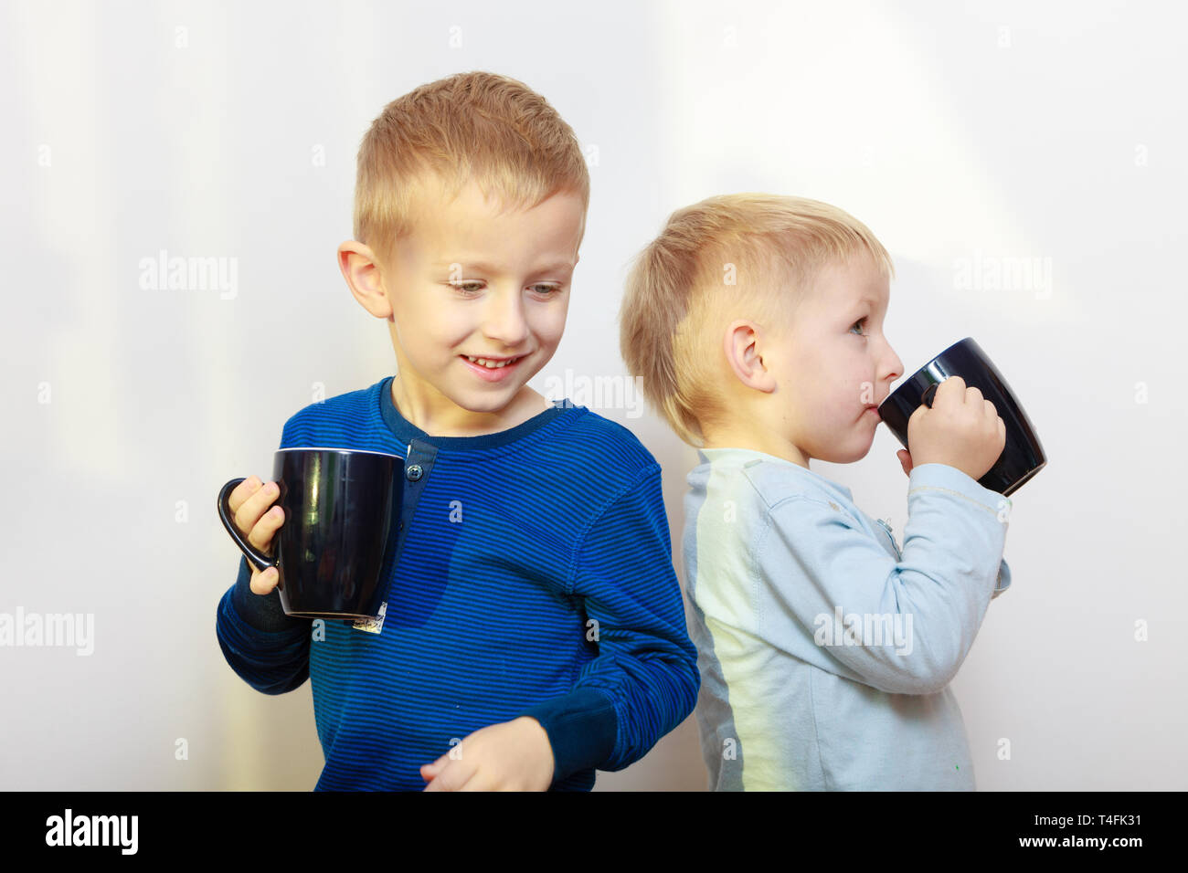 Good daily human hydration concept. Two boys, thirsty kids drinking ...