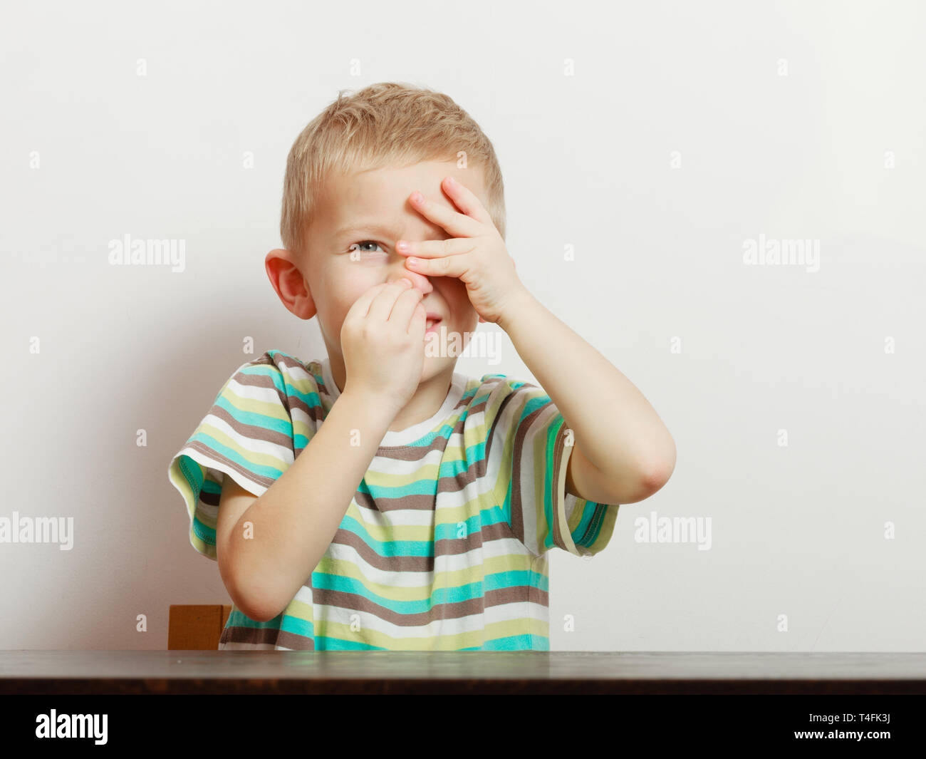 Face expressions, children concept. Portrait of happy kid boy sitting ...