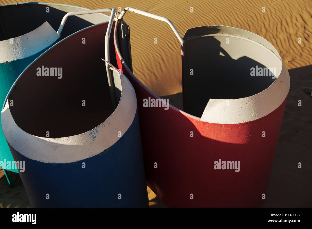 Multi colored beach changing rooms at the sandy beach. Cabins dressing ...