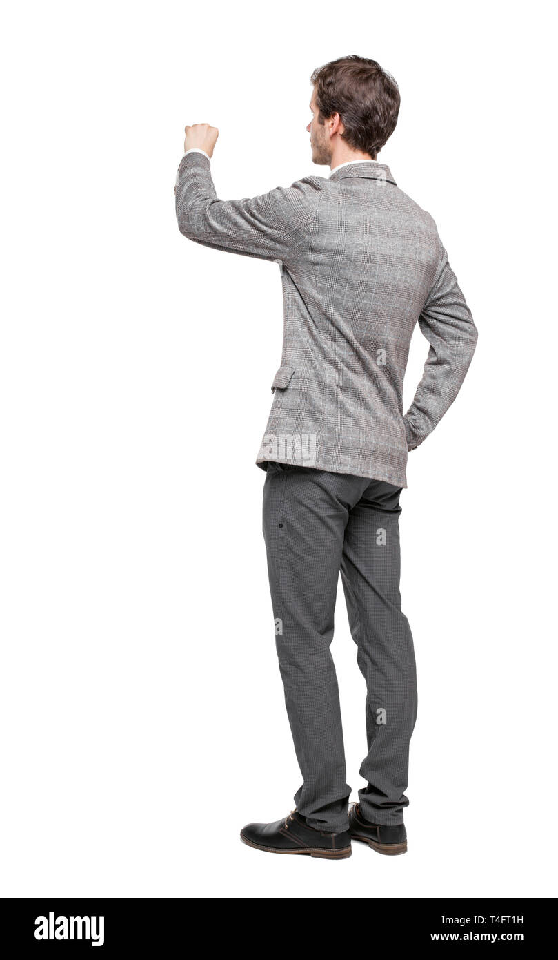 back view of writing business man in suit. Young in draws. Rear view ...